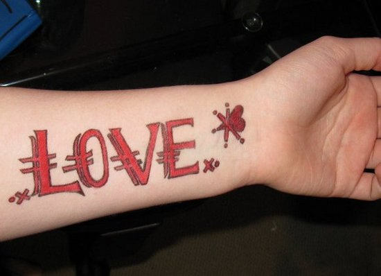 bold red ink love word tattoo – EntertainmentMesh